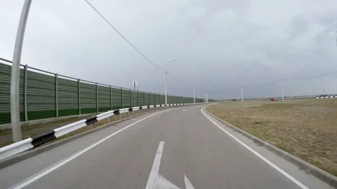 The car is driving exit from highway. Re... | Stock Video | Pond5