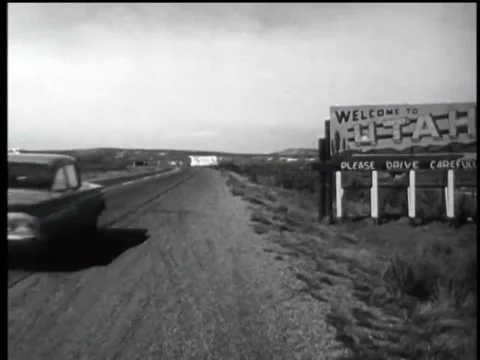 Car driving past Welcome to Utah sign on... | Stock Video | Pond5