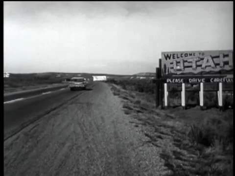 Car driving past Welcome to Utah sign on... | Stock Video | Pond5