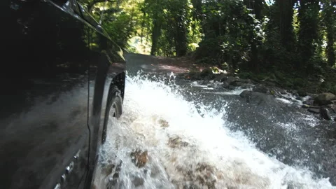 Car driving through water on flooded asp... | Stock Video | Pond5