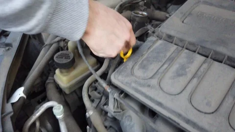 Car oil fill. Checks the car oil level w... | Stock Video | Pond5