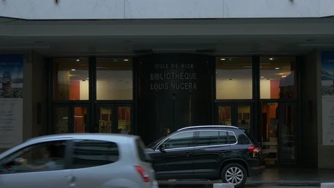 A car parked in front of a library | Stock Video | Pond5