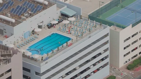 Car parking lot with rooftop swimming po... | Stock Video | Pond5