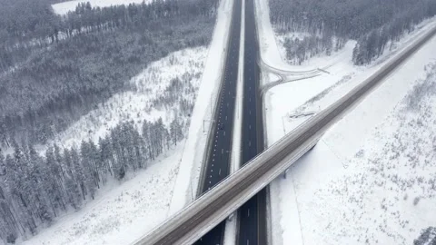 A car passes under a bridge on a highway... | Stock Video | Pond5