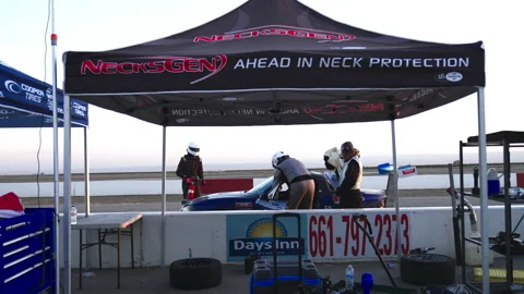Car racing team members fueling the spor... | Stock Video | Pond5