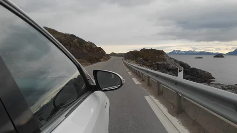 Car ride along coast of Lofoten. Car sid... | Stock Video | Pond5