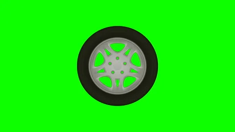 Car tire bouncing in and rolling off gre... | Stock Video | Pond5