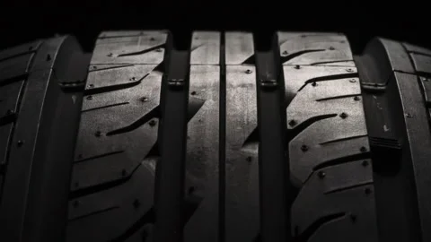 Car Tire Rotates on a Black Background 4... | Stock Video | Pond5