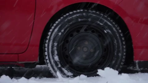 Car Tire Stuck in Snow Spinning Sliding ... | Stock Video | Pond5