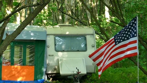 Caravan ,trailer with American flag in w... | Stock Video | Pond5