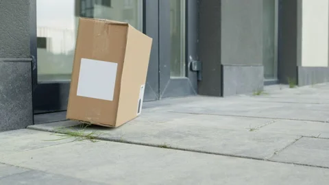 Cardboard Box Falls Under The Door Of Th... | Stock Video | Pond5