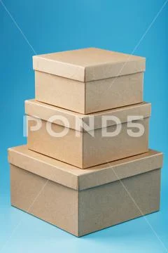 Cardboard boxes spread out on a blue background, free space. ~ Premium ...
