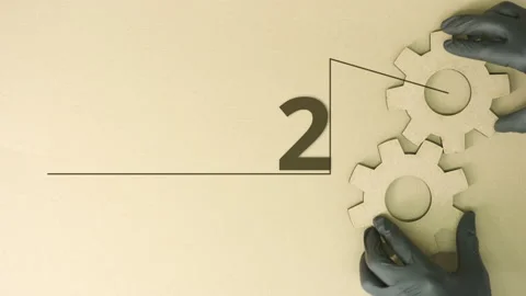 Cardboard cog wheels and 2023 text on th... | Stock Video | Pond5