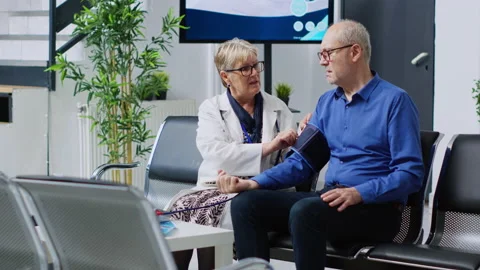 Cardiologist measuring man pulse pressur... | Stock Video | Pond5