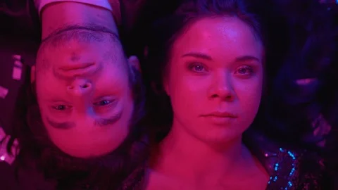 Carefree couple relaxing at rave party l... | Stock Video | Pond5