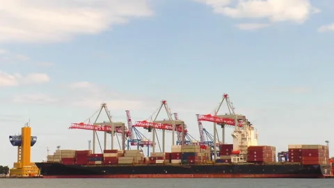 Cargo container ship moving load at port... | Stock Video | Pond5