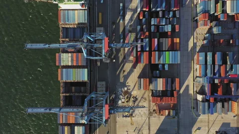 Cargo containers being unloaded by a gan... | Stock Video | Pond5