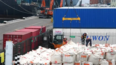 Cargo loading on a ship at the seaport. | Stock Video | Pond5