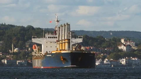 A cargo ship maneuvering into position a... | Stock Video | Pond5