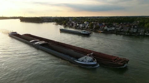 A cargo ship with side attached barge pa... | Stock Video | Pond5