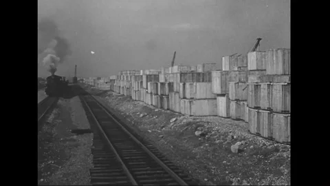 Cargo train loaded with crates moves alo... | Stock Video | Pond5