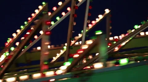 a carnival ride at night with flashing l... | Stock Video | Pond5