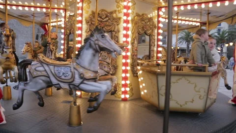Carousel for kids, with galloping horses... | Stock Video | Pond5