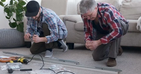 Carpenters using a screwdriver to screw ... | Stock Video | Pond5