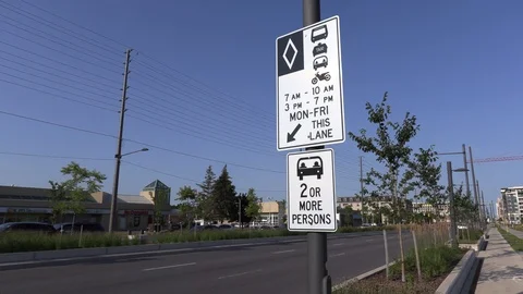 Carpool taxi and transit bus lane signs ... | Stock Video | Pond5
