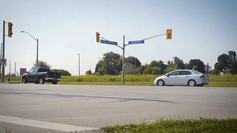 Cars Driving Through Intersection Stock Video Footage | Royalty Free ...