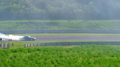 Cars drifting on a racing circuit with l... | Stock Video | Pond5