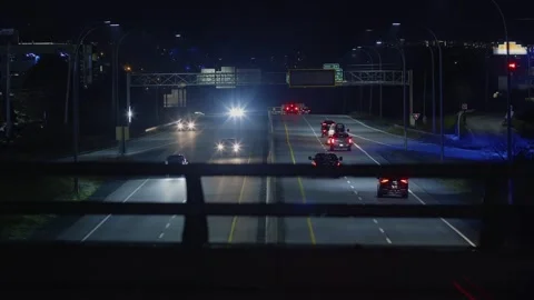 Cars drive along the expressway at night... | Stock Video | Pond5