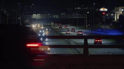 Cars drive along the expressway at night... | Stock Video | Pond5