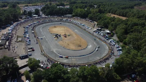 cars going round a race track in the for... | Stock Video | Pond5