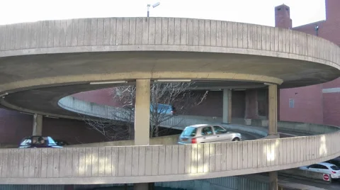 Cars on spiral concrete ramp to rooftop ... | Stock Video | Pond5