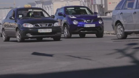 Cars stand at the intersection with a tr... | Stock Video | Pond5