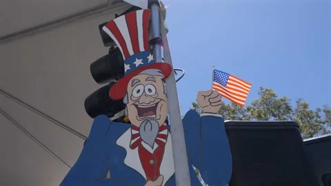 Cartoon Uncle Sam holding an American fl... | Stock Video | Pond5