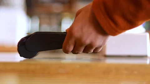 A cashier operates a POS machine. Hand o... | Stock Video | Pond5