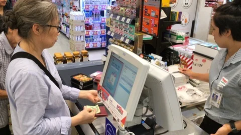 cashier at work in Thai supermarket | Stock Video | Pond5