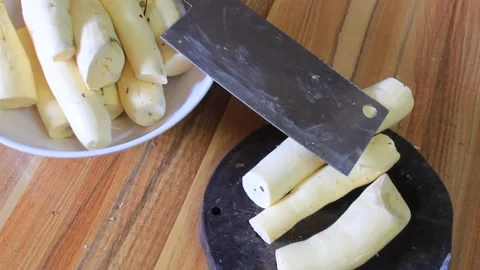 Cassava Root Fruit on a Table in removin... | Stock Video | Pond5
