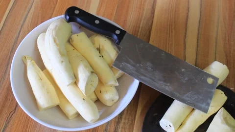 Cassava Root Fruit on a Table in removin... | Stock Video | Pond5