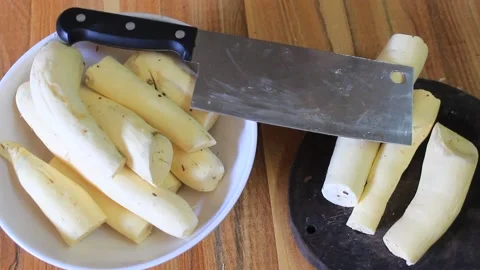 Cassava Root Fruit on a Table in removin... | Stock Video | Pond5