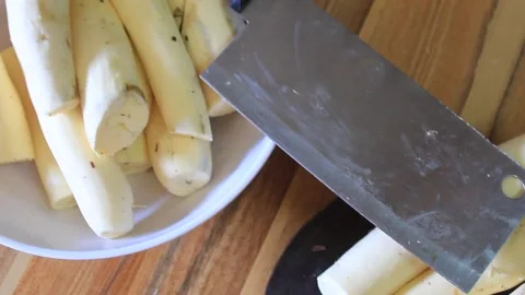 Cassava Root Fruit on a Table in removin... | Stock Video | Pond5