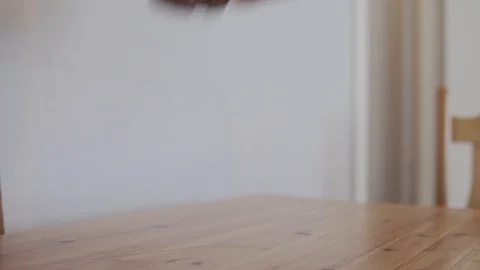 Cat jumping on the table and eating a sp... | Stock Video | Pond5