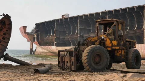 CAT Wheel Loader Moving Steel From Hull ... | Stock Video | Pond5
