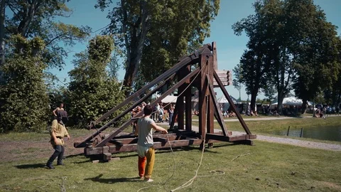 Catapult towards lake. Medieval knight i... | Stock Video | Pond5