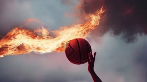 Catching basketball in flame of fire loo... | Stock Video | Pond5