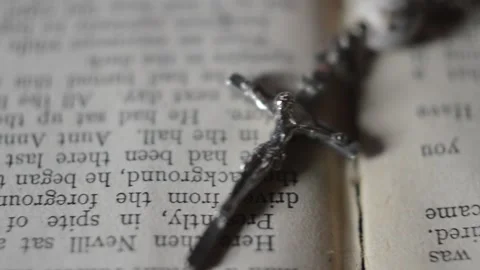 catholic god crucifix on a holy bible bi... | Stock Video | Pond5