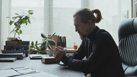 Catholic Pastor Praying In Office | Stock Video | Pond5