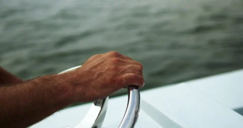 Caucasian boat captain steering skiff bo... | Stock Video | Pond5